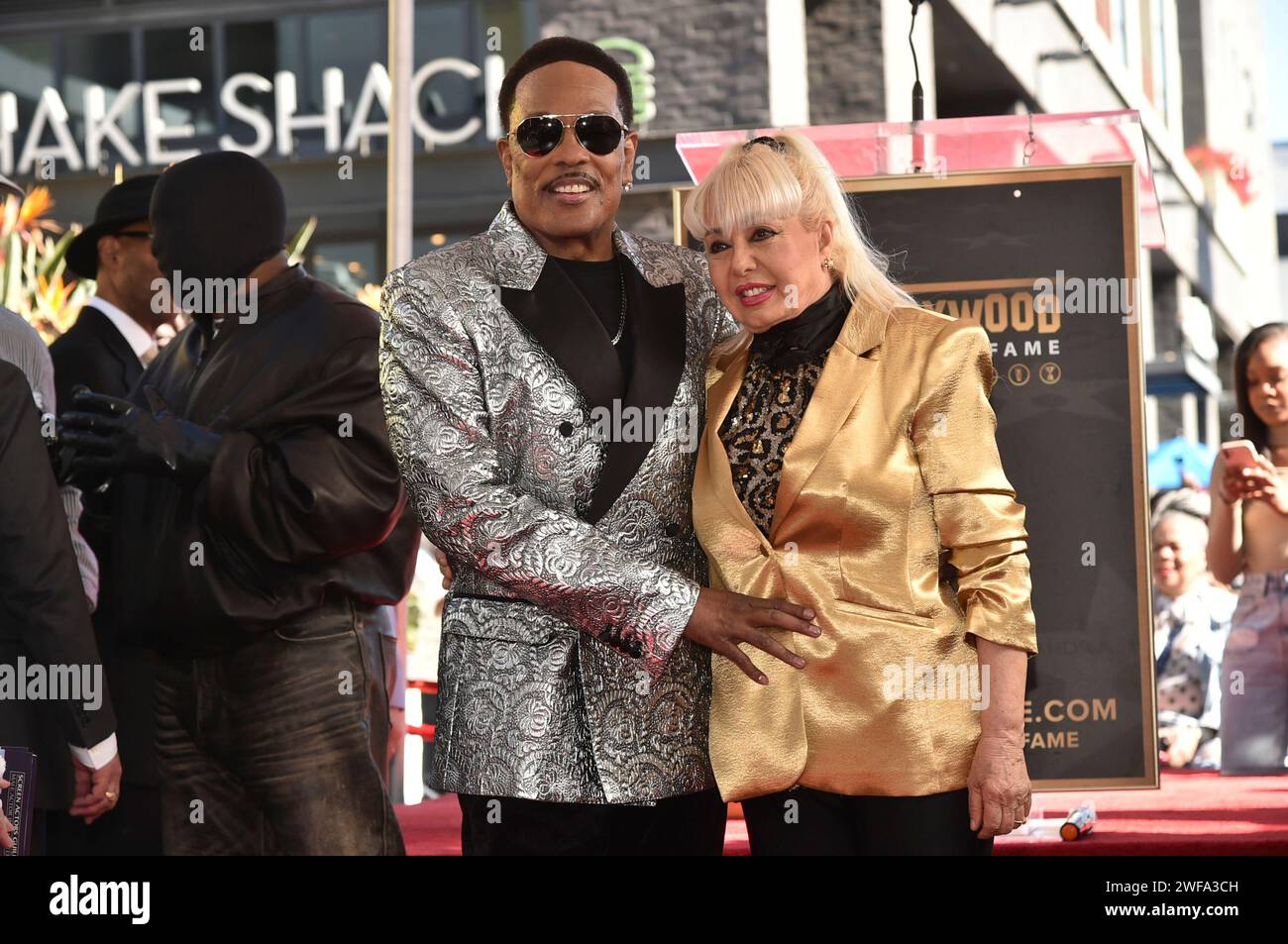 Charlie Wilson, left, and Mahin Wilson attend a ceremony honoring ...