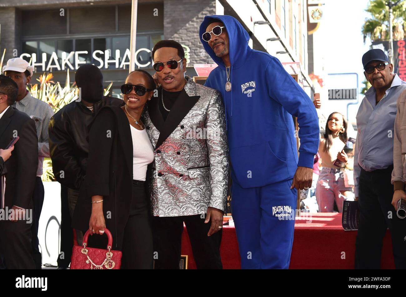 Shante Broadus, from left, Charlie Wilson, and Snoop Dogg attend a ...