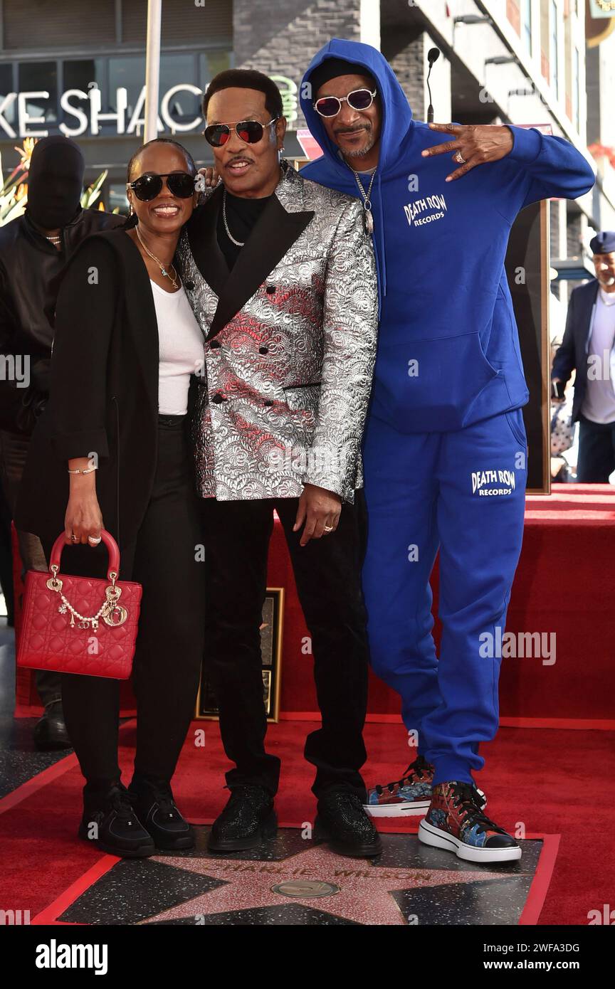 Shante Broadus, from left, Charlie Wilson, and Snoop Dogg attend a ...