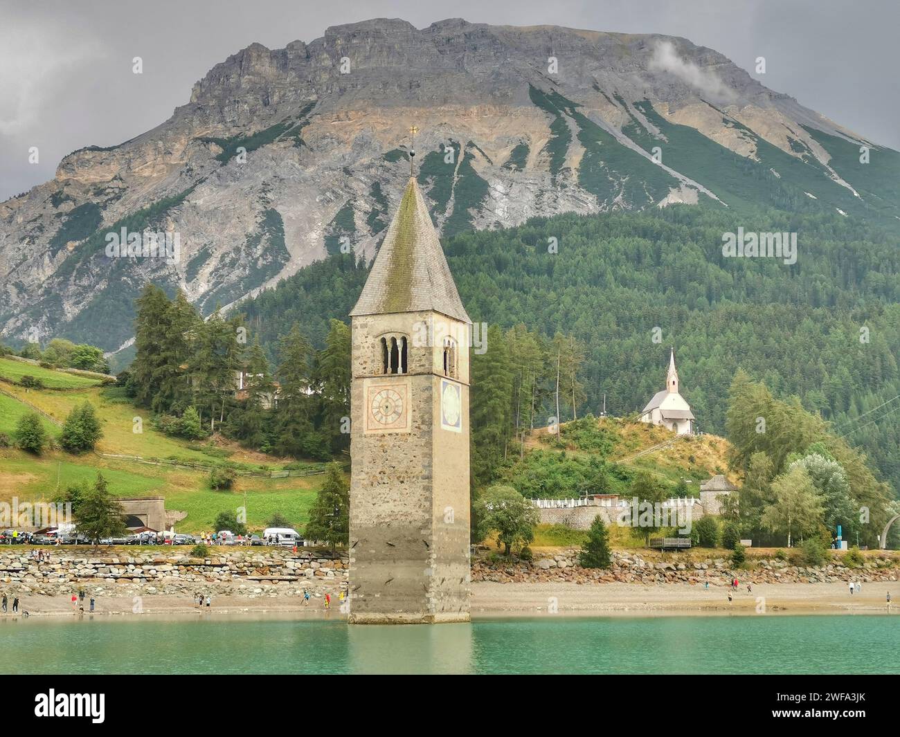 The historic Tower of Sunken Church near Lago di Resina in South Tyrol ...