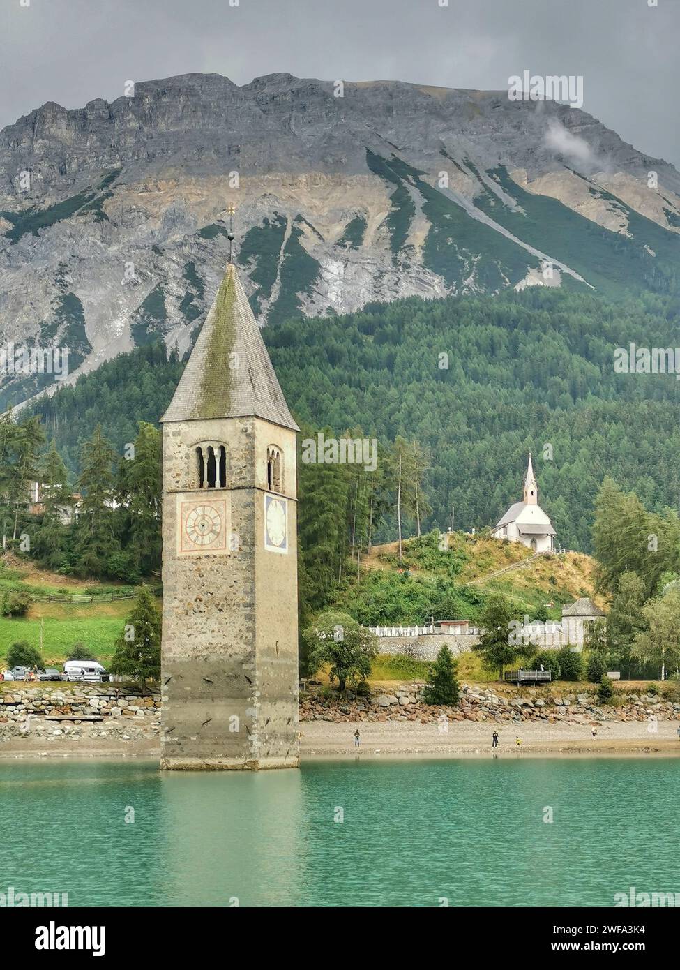 The historic Tower of Sunken Church near Lago di Resina in South Tyrol ...