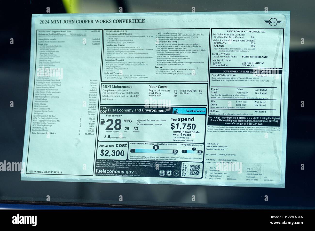 The window sticker hangs in an unsold 2024 Cooper S John Cooper Works ...