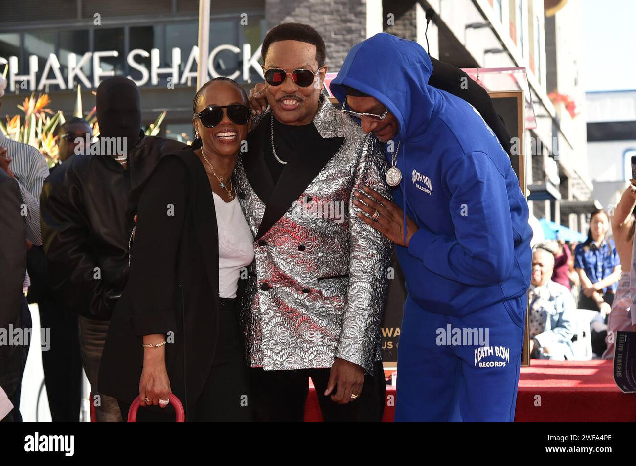 Shante Broadus, from left, Charlie Wilson, and Snoop Dogg attend a ...