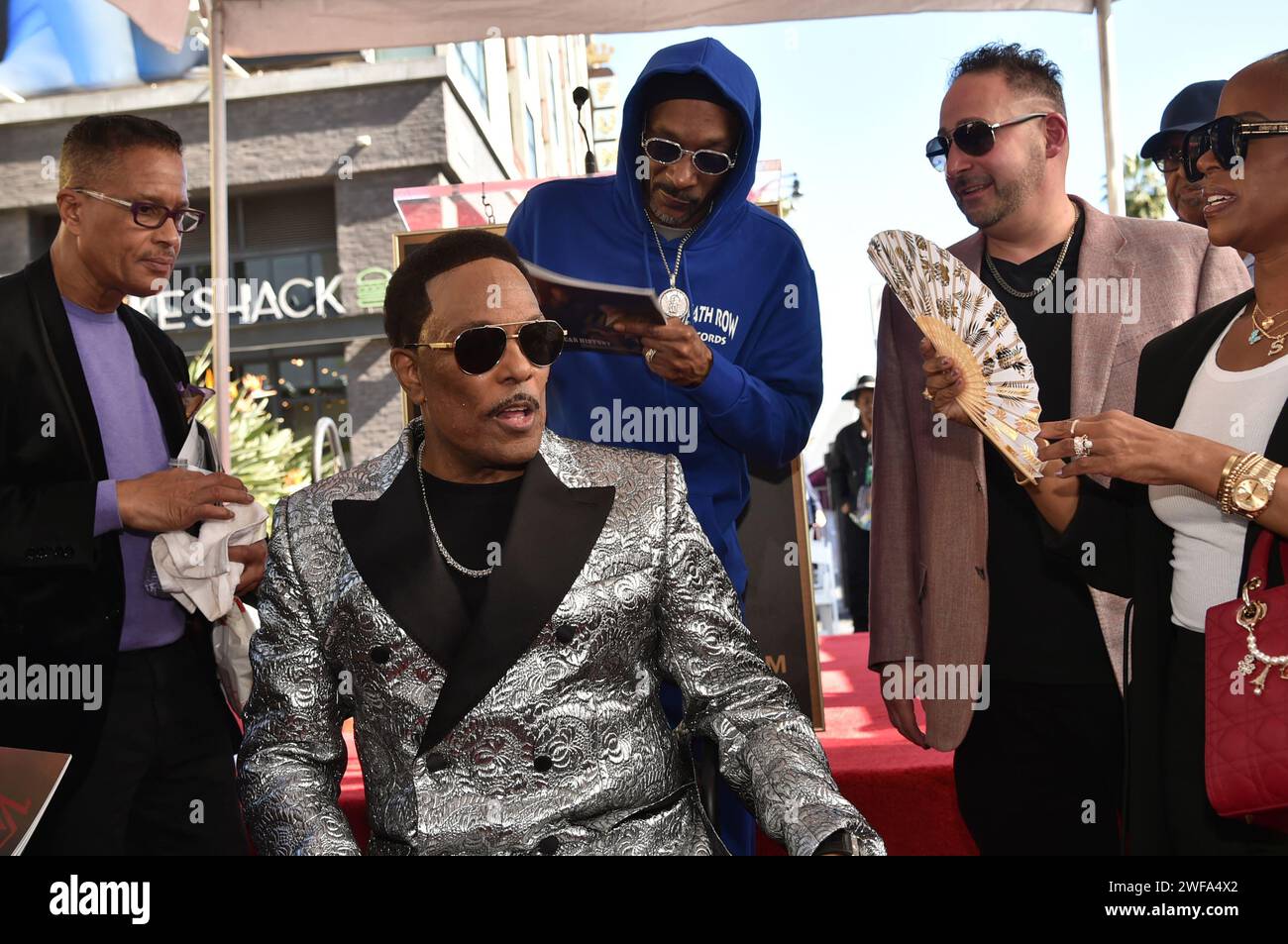 Charlie Wilson, Snoop Dogg, and Shante Broadus attend a ceremony ...