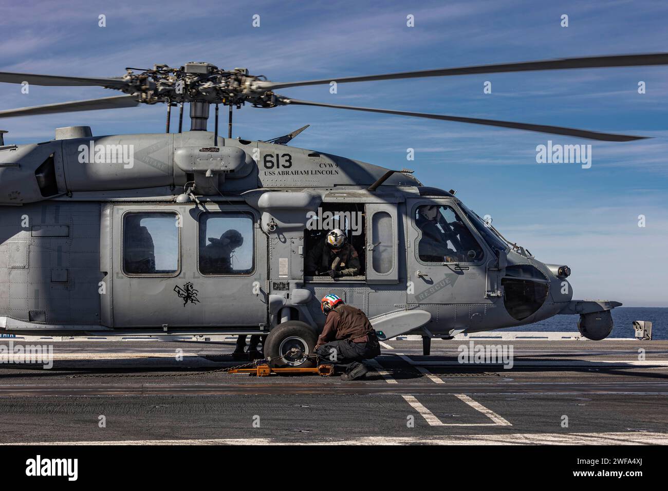 240127-N-LM220-1044 PACIFIC OCEAN (Jan. 27, 2024) Sailors secure an MH ...