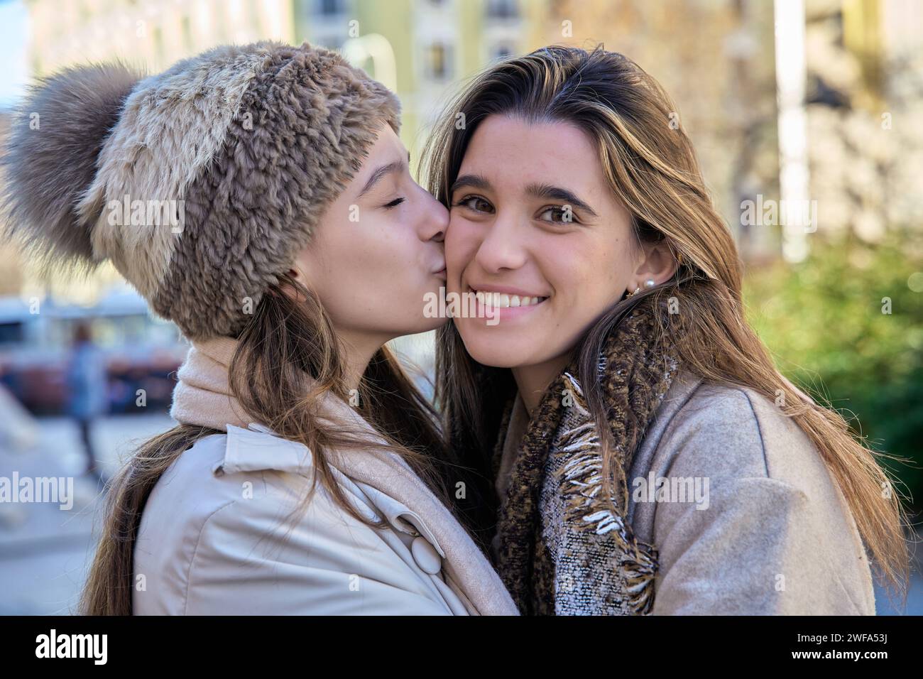 Two women hugging kissing hi-res stock photography and images - Alamy