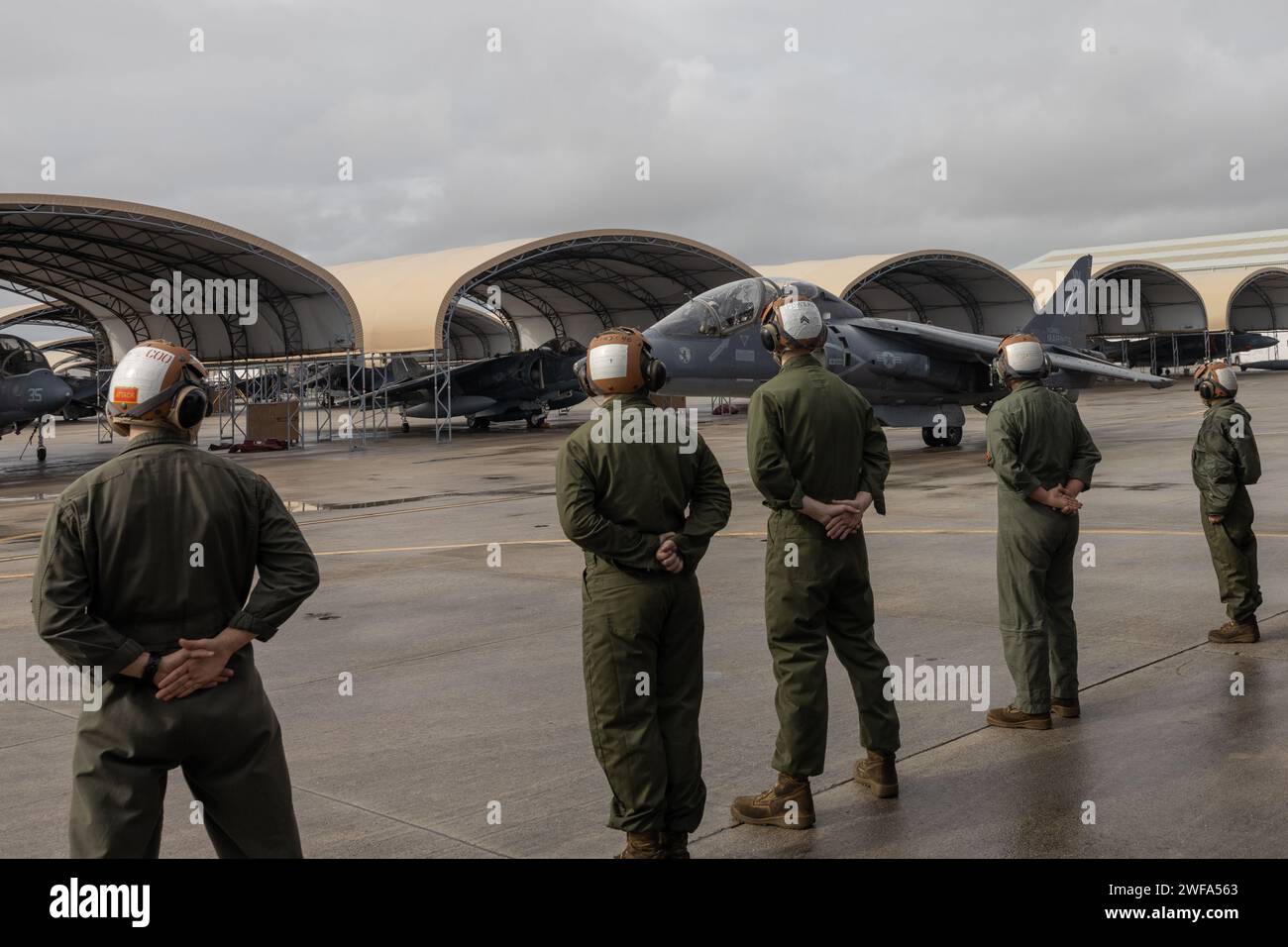 U.S. Marines with Marine Attack Squadron (VMA) 223 watch an AV-8B ...