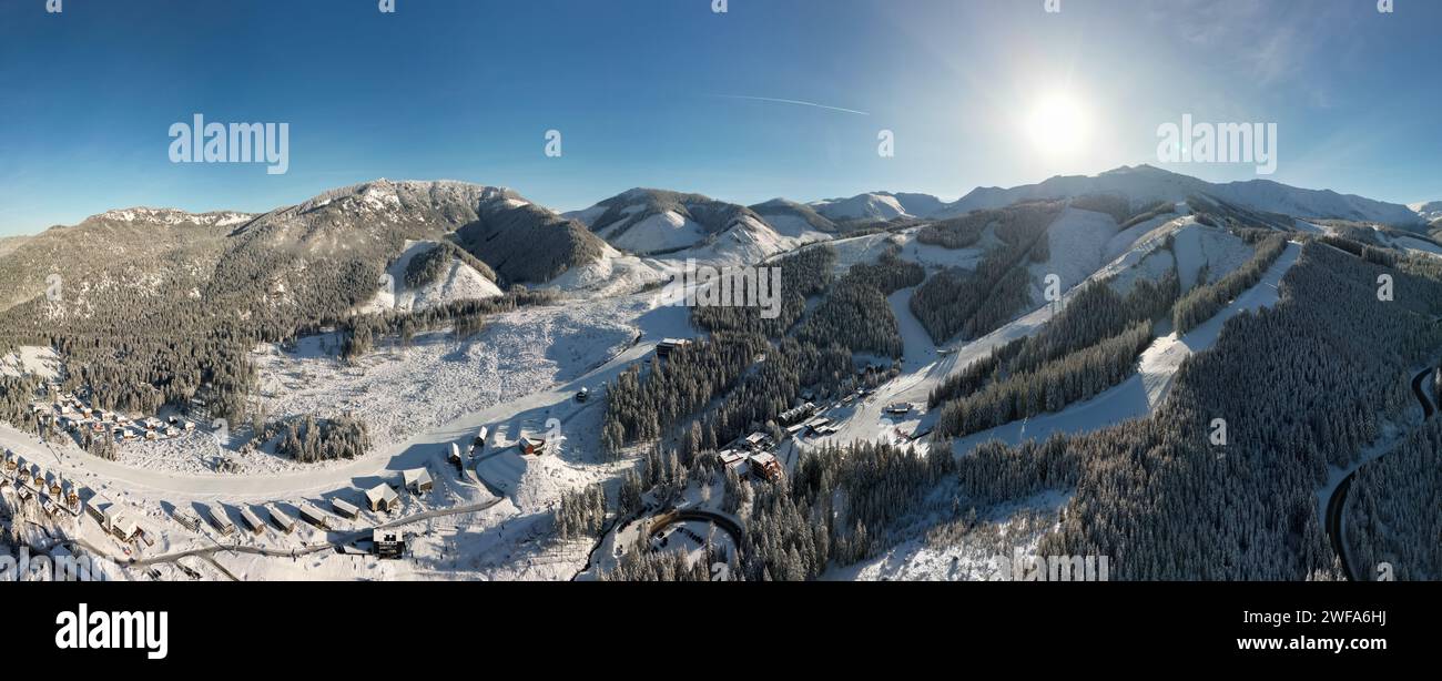 Aerial panoramic winter view of Demanovska Dolina village in Low Tatras ...
