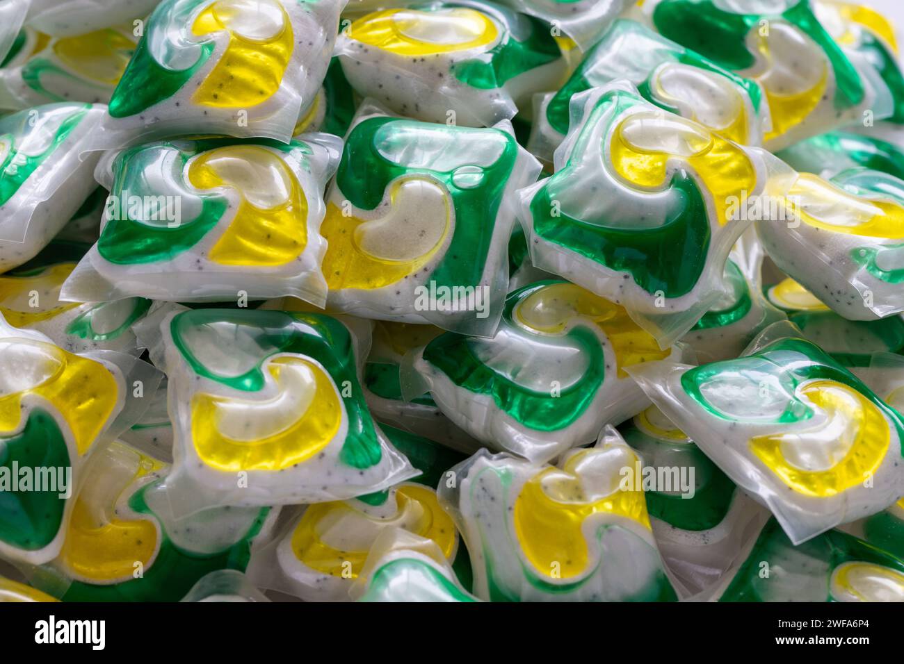Dishwasher detergent capsules and or laundry soap close up background ...
