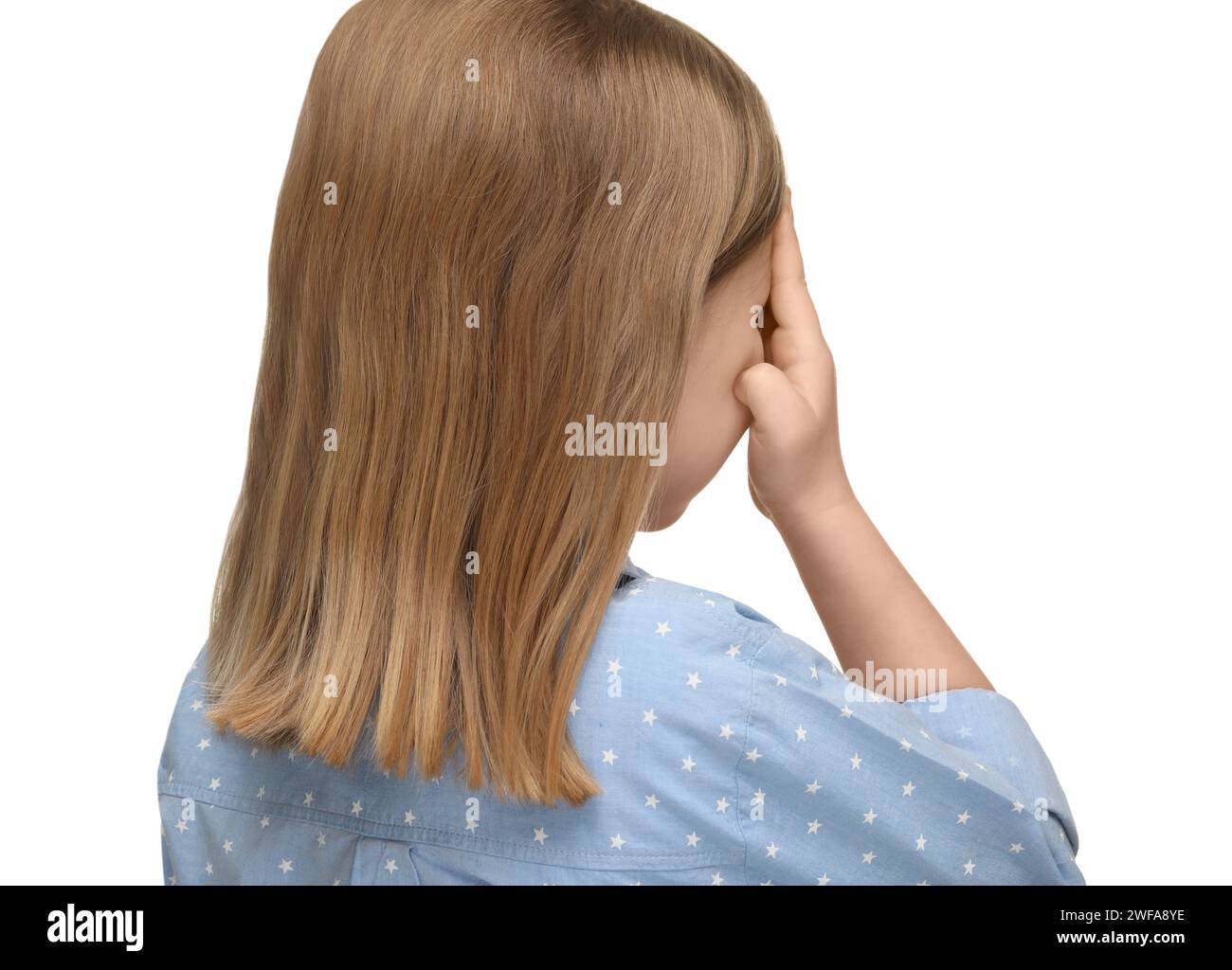 Little girl covering her eye on white background, back view Stock Photo ...