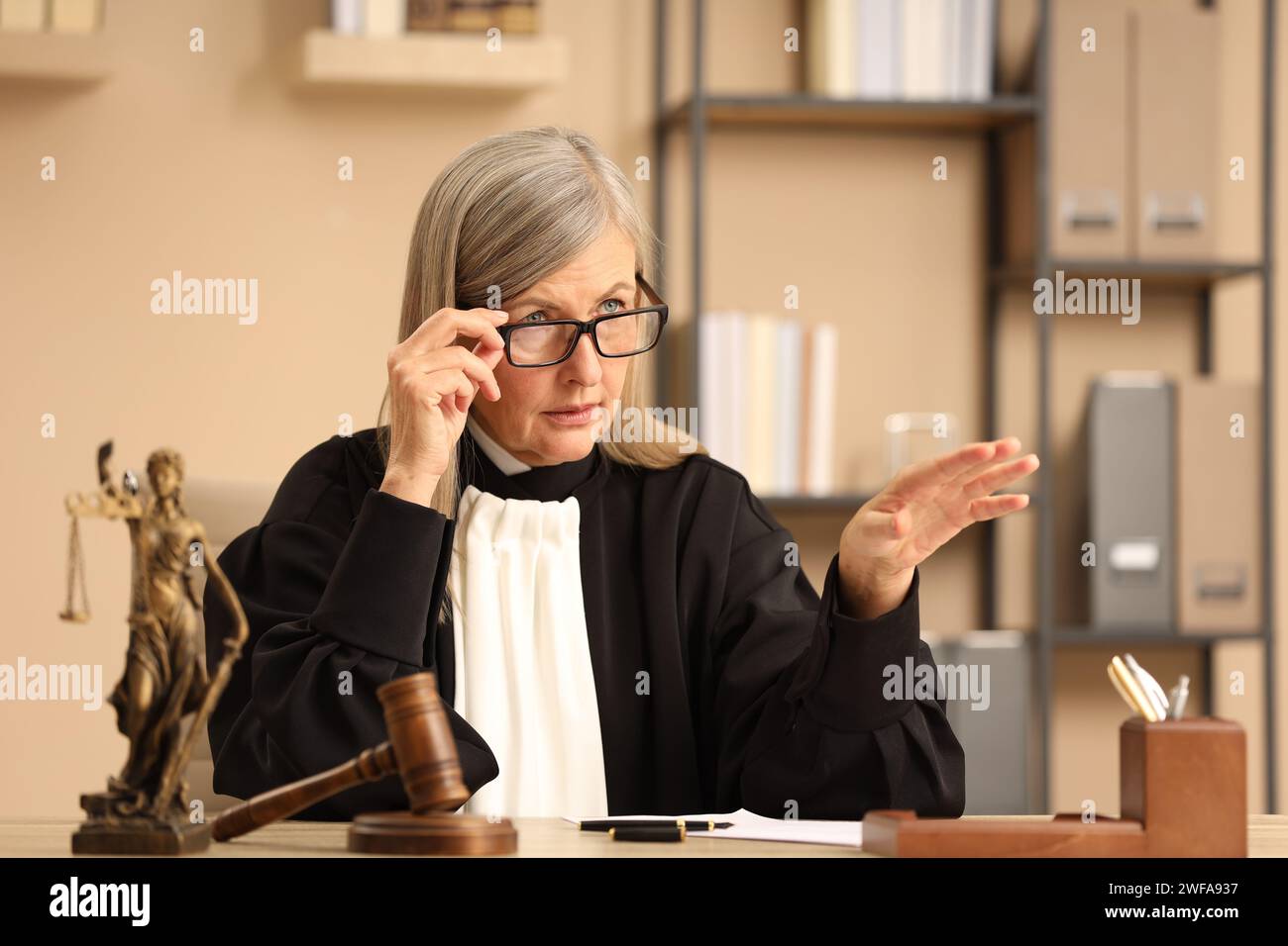 Female judge glasses in courtroom hi-res stock photography and images ...