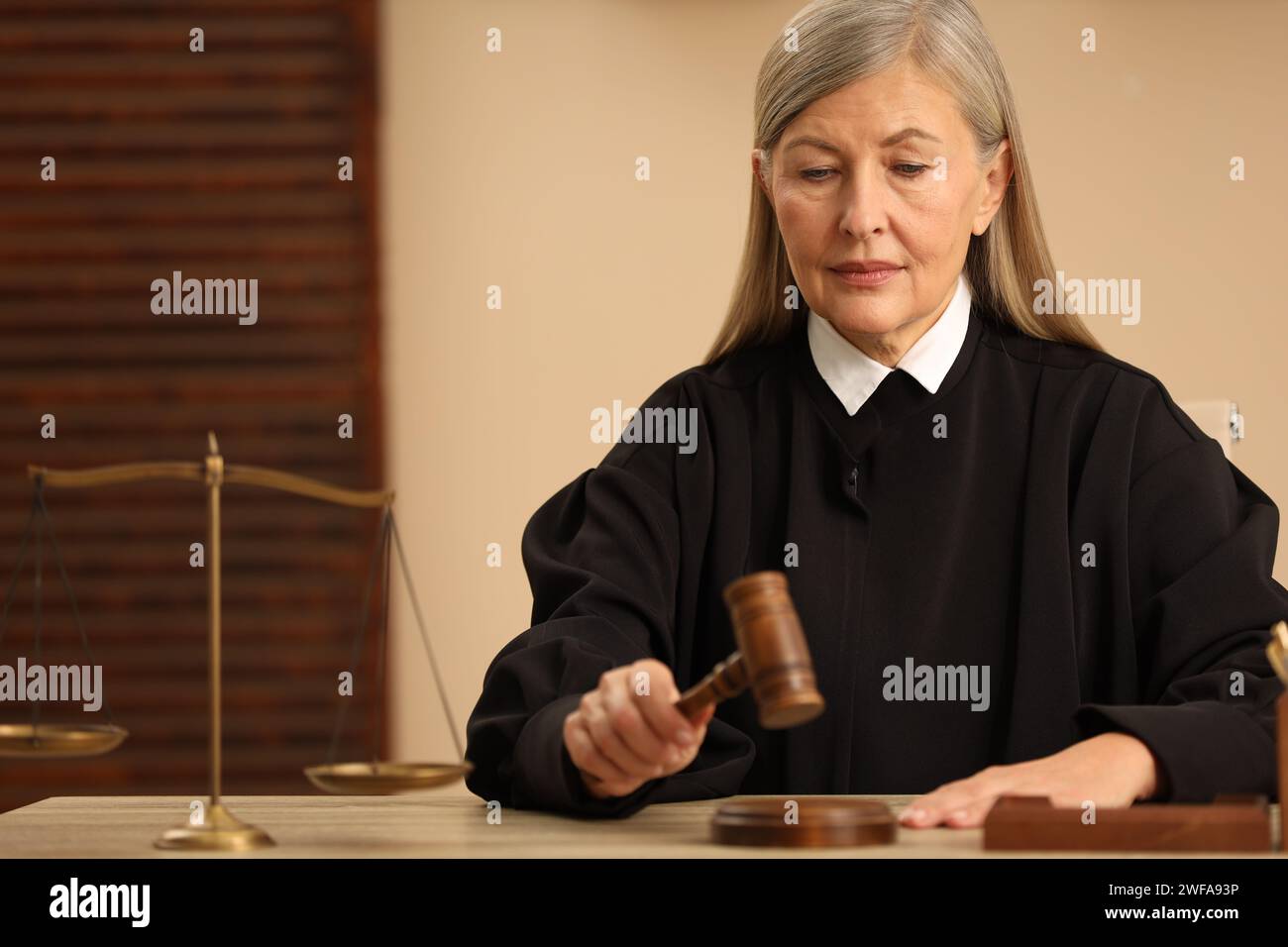 Mature female judge scales hi-res stock photography and images - Alamy