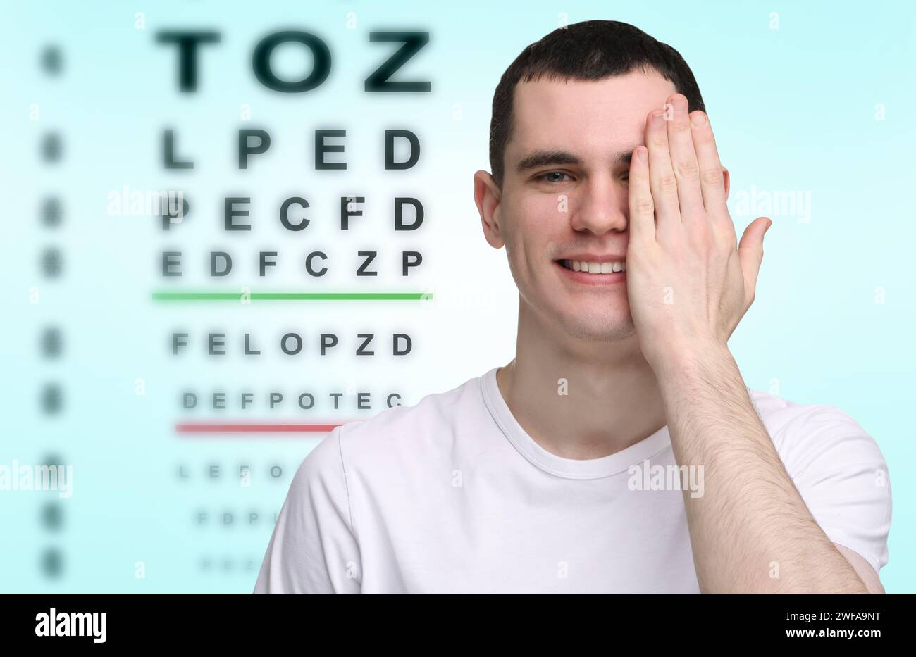 Vision test. Young man and eye chart on gradient background Stock Photo ...