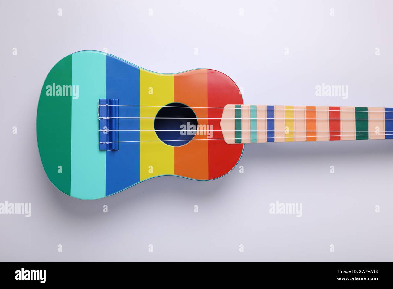 Colorful ukulele on white background, top view. String musical ...