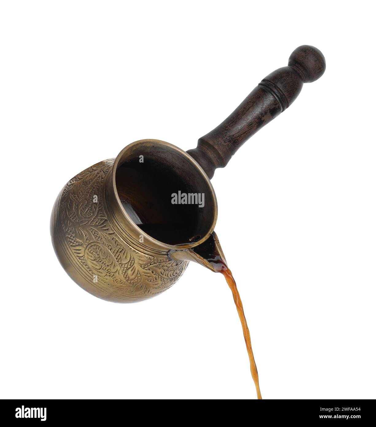 Turkish coffee. Pouring brewed beverage from cezve on white background ...