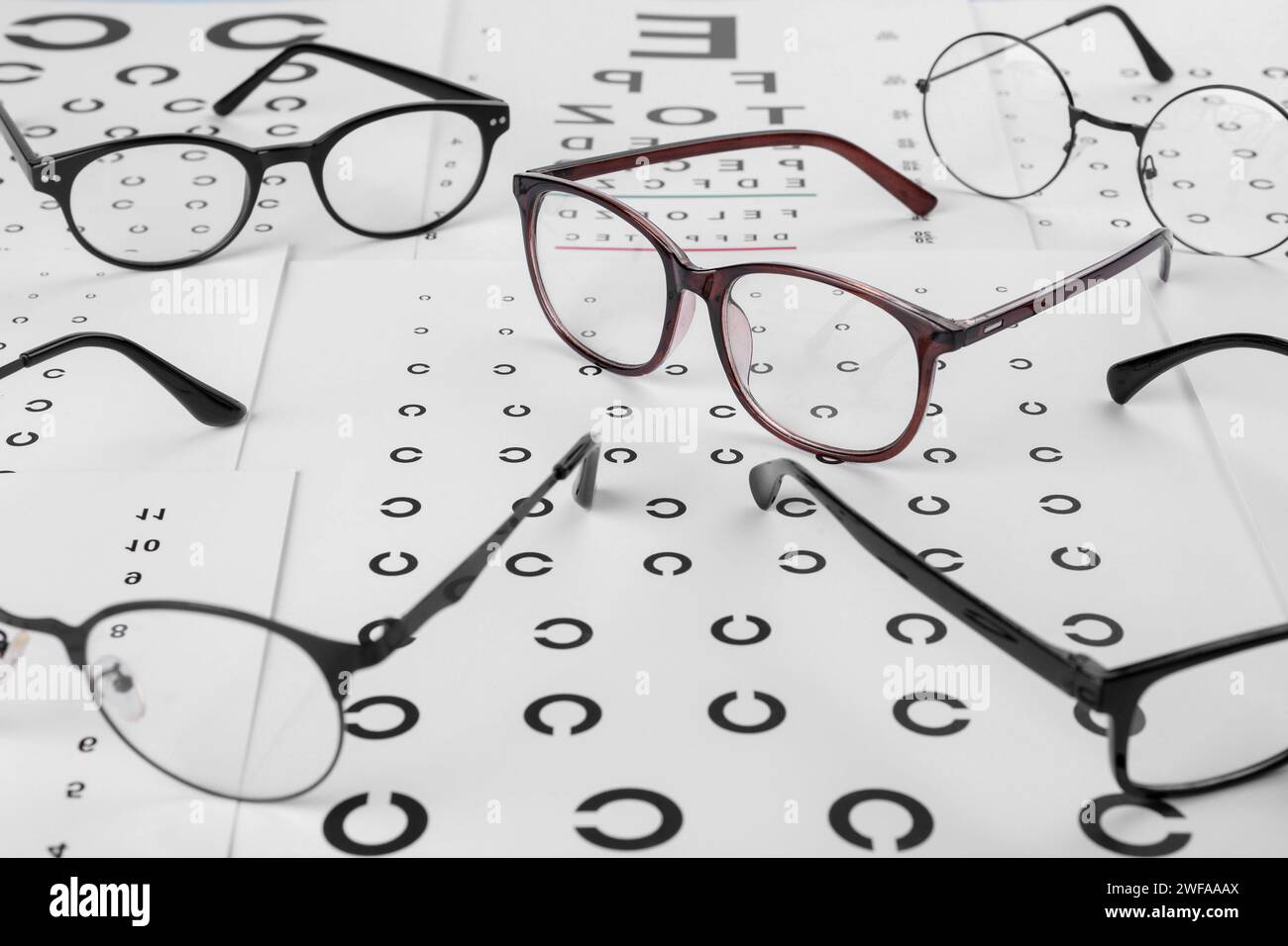 Vision test charts and glasses on table, closeup Stock Photo - Alamy