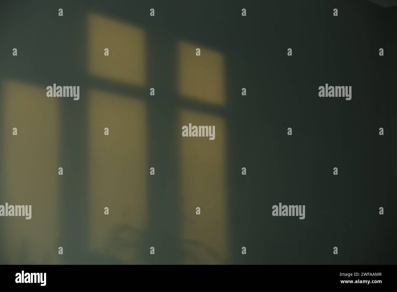 Light and shadows from window on wall indoors Stock Photo - Alamy