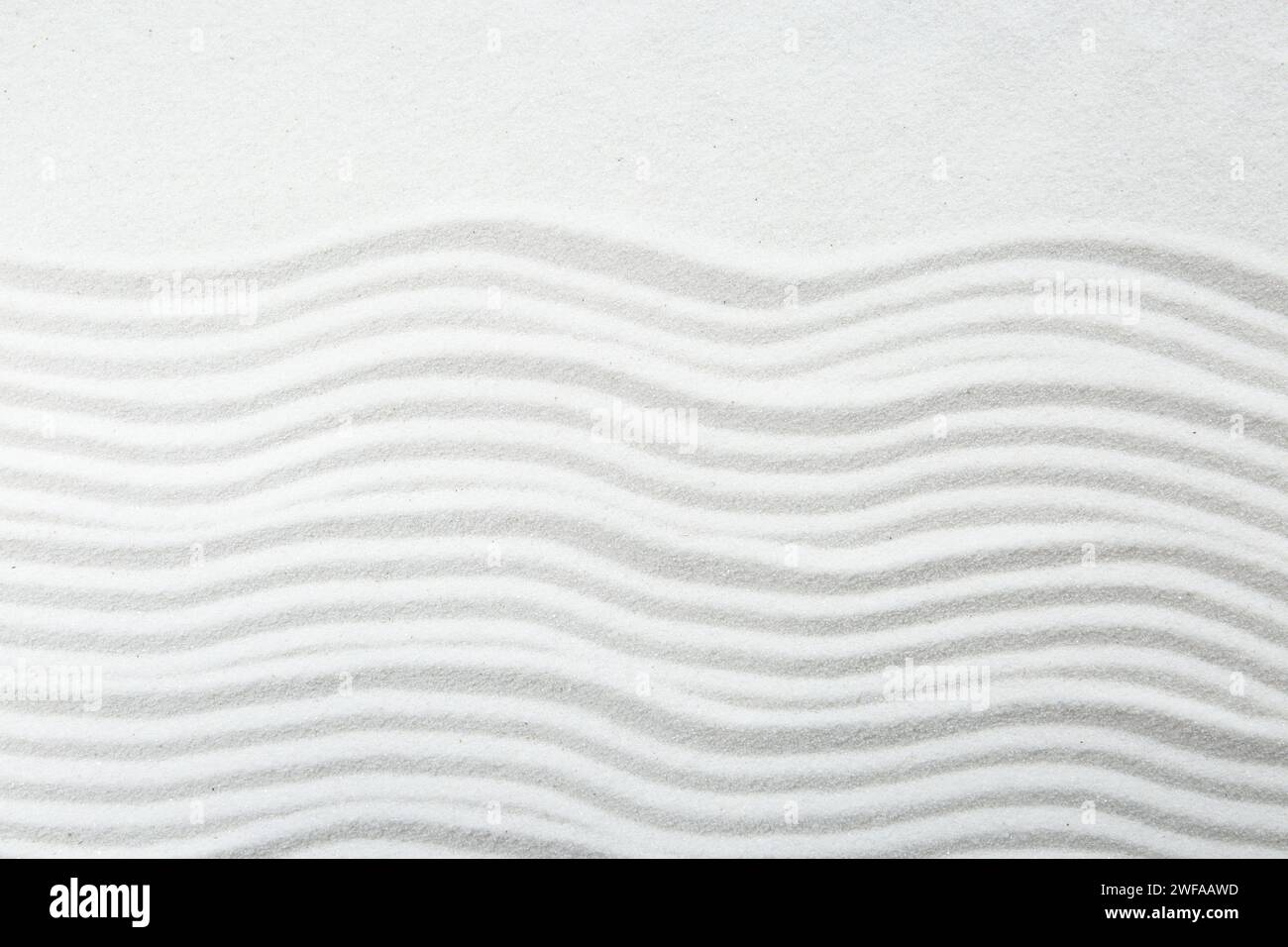 Zen rock garden. Wave pattern on white sand, top view Stock Photo - Alamy