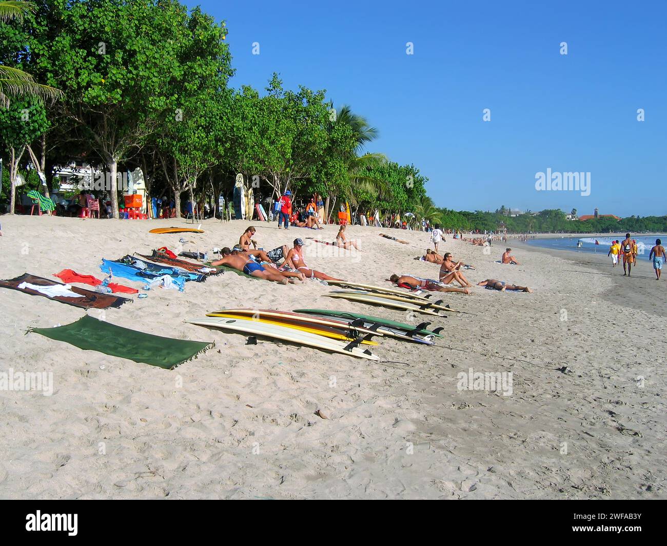 Sunbathers and surfboards on Kuta Beach in Bali, Indonesia Stock Photo ...