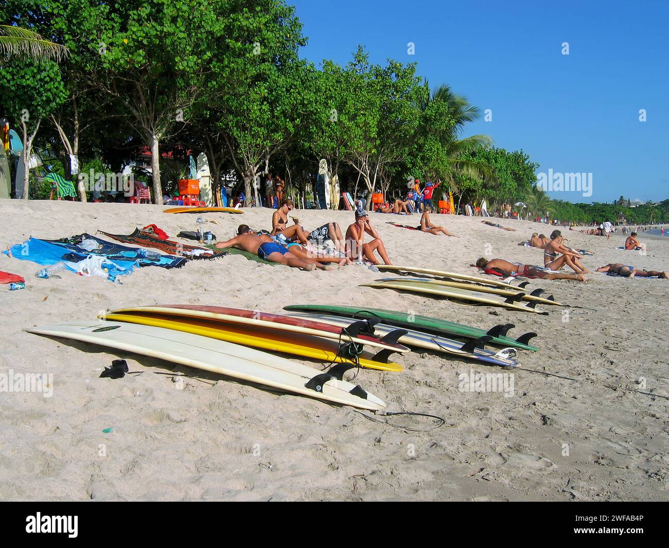 Sunbathers and surfboards on Kuta Beach in Bali, Indonesia Stock Photo ...
