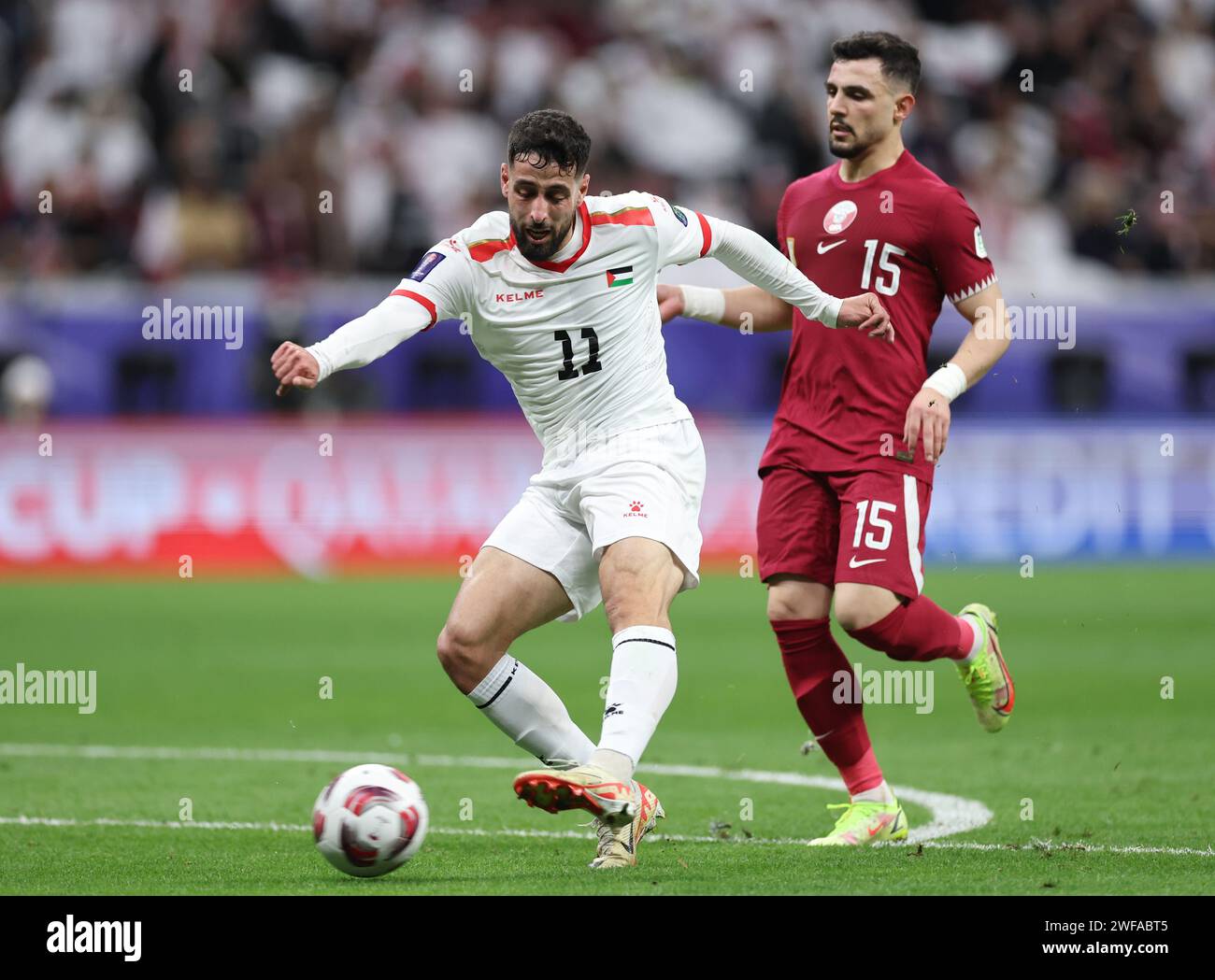 Doha, Qatar. 29th Jan, 2024. Oday Dabbagh (L) of Palestine shoots to ...