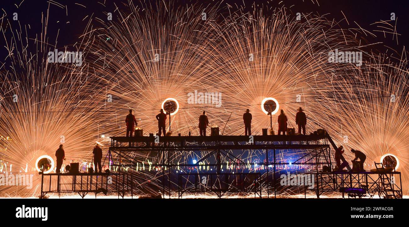 Beijing, China's Henan Province. 28th Jan, 2024. Folk artists perform ...
