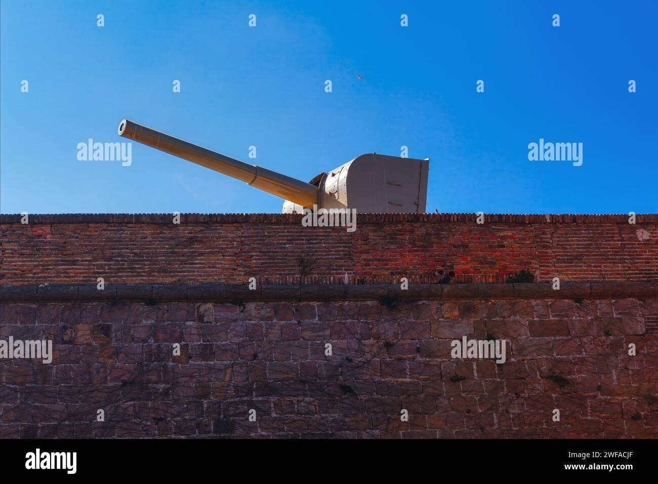 Machine Gun on the top of the fortress wall against the blue sky Stock ...
