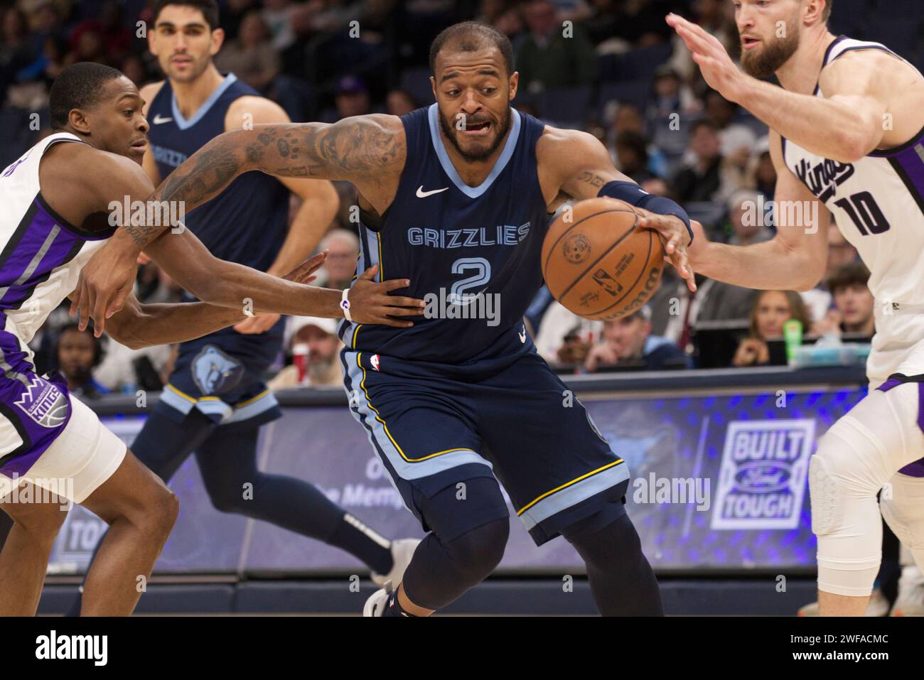 Sacramento Kings guard De'Aaron Fox, left, and forward Domantas Sabonis (10) defend against ...