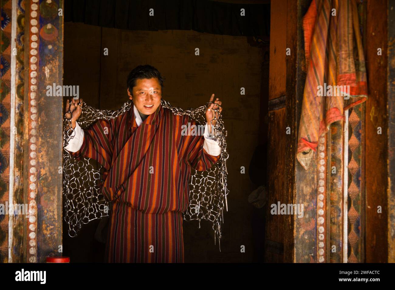 Bhutanese man shoulders an iron mail for penance, a traditional act ...