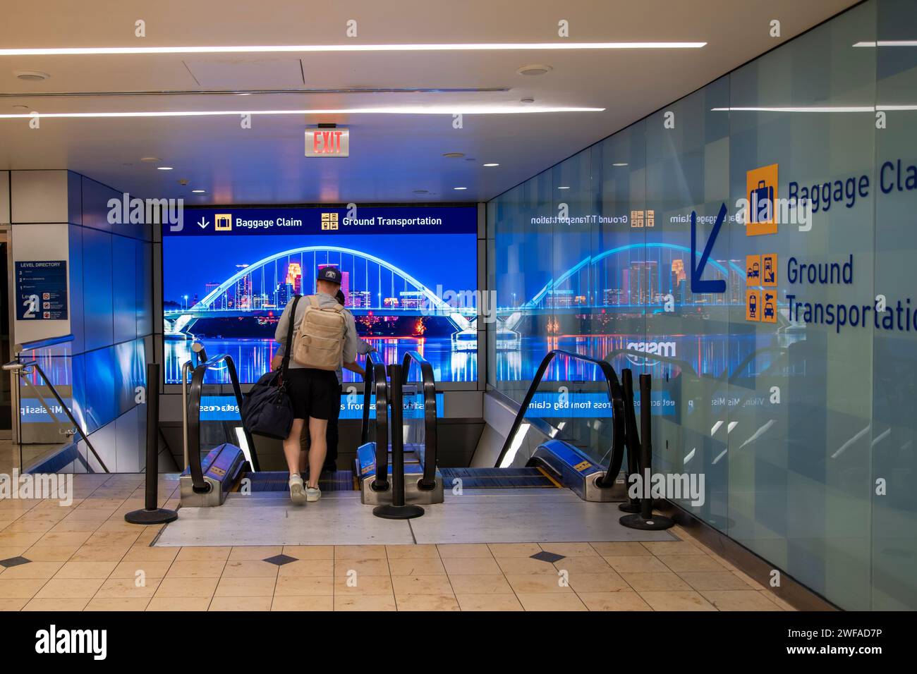 Bloomington, Minnesota. MSP airport. Travelers taking the escalator ...