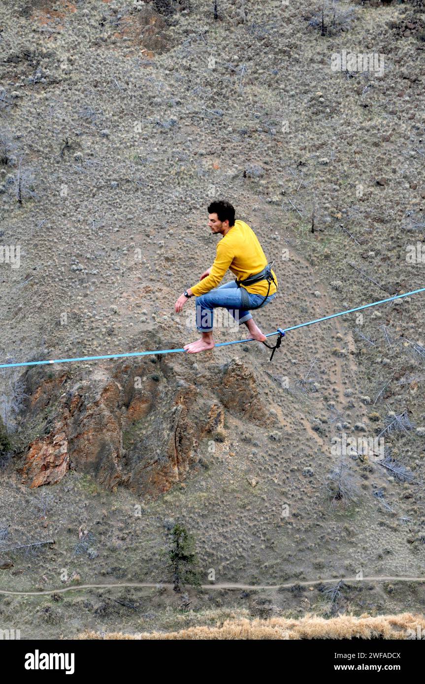 Single male slackline walking in Smith Rock State Park. Central Oregon ...
