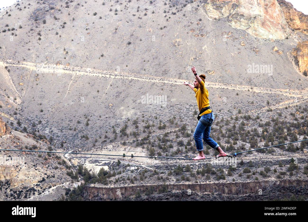 Single male slackline walking in Smith Rock State Park. Central Oregon ...