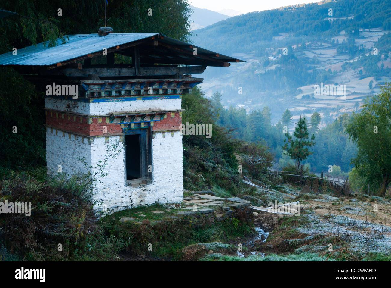 Tiny Bhutanese storage building on a farm above terraced rice fields in ...