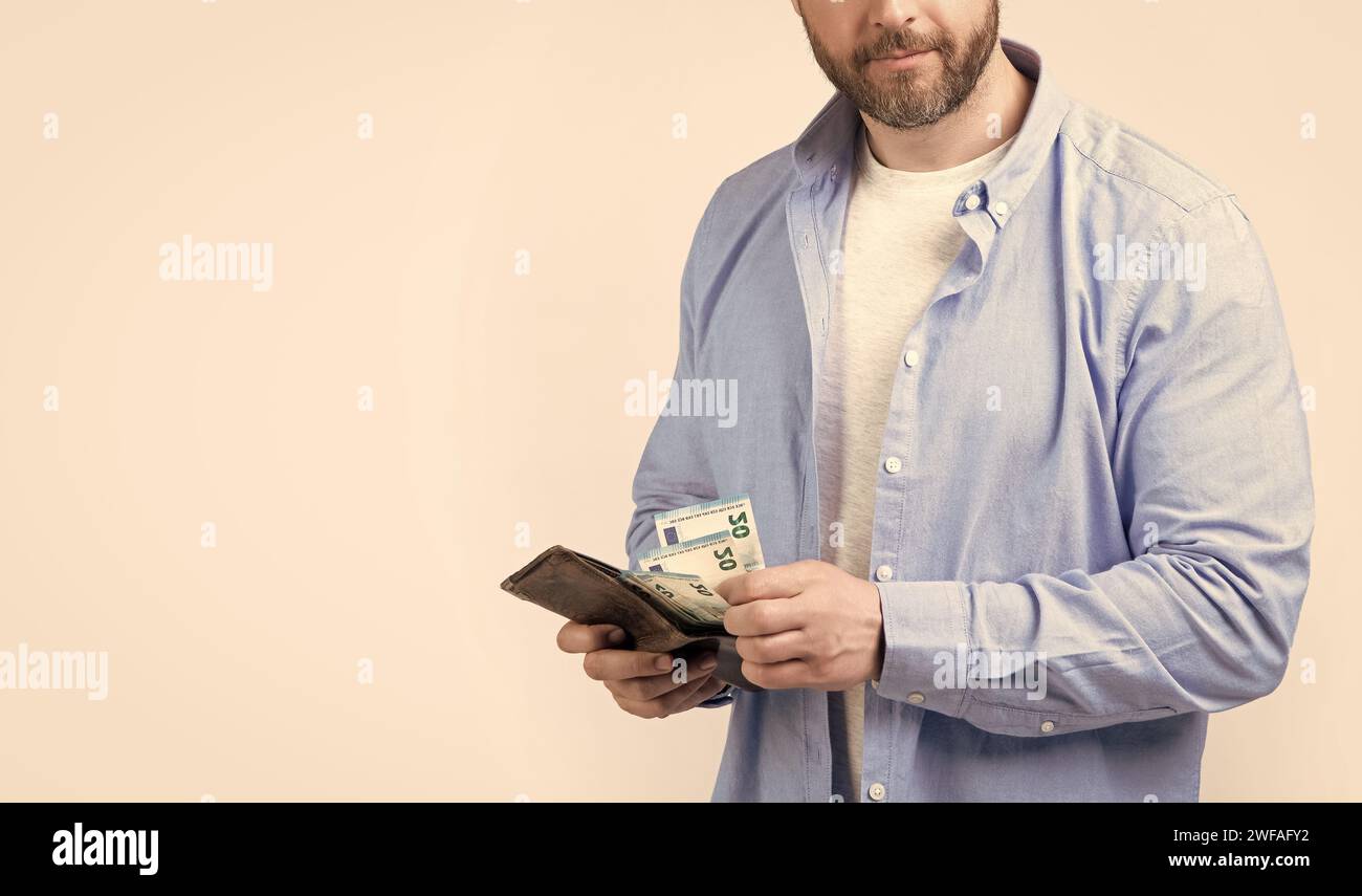 photo of man pay salary, copy space. man pay salary isolated on studio ...