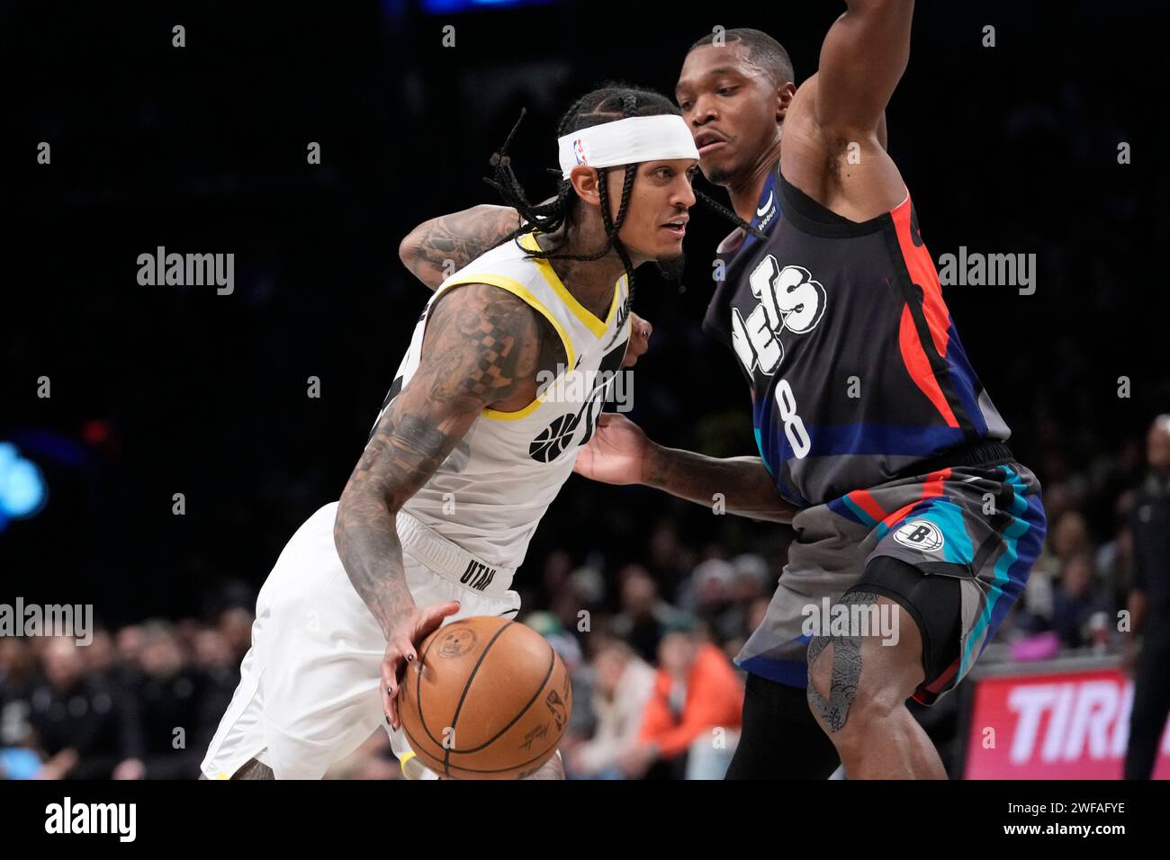 Utah Jazz guard Jordan Clarkson, left, drives against Brooklyn Nets ...