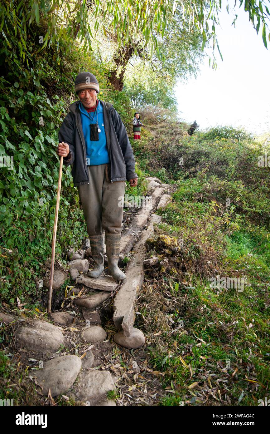 Young Bhutanese boy gets distracted by his surroundings as he walks ...