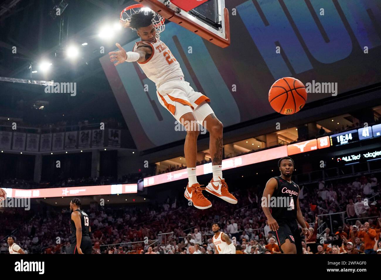 Texas forward Dillon Mitchell (23) scores against Houston during the ...