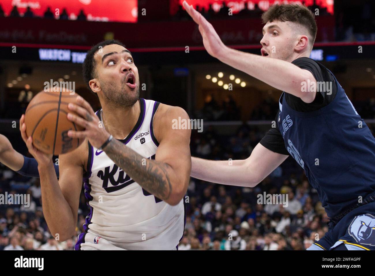 Sacramento Kings forward Trey Lyles, left, drives into the lane ...