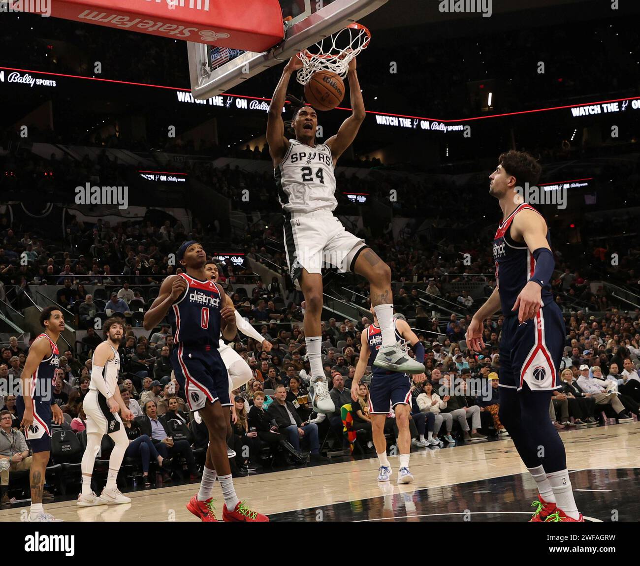 San Antonio Spurs guard Devin Vassell (24) dunks against Washington ...