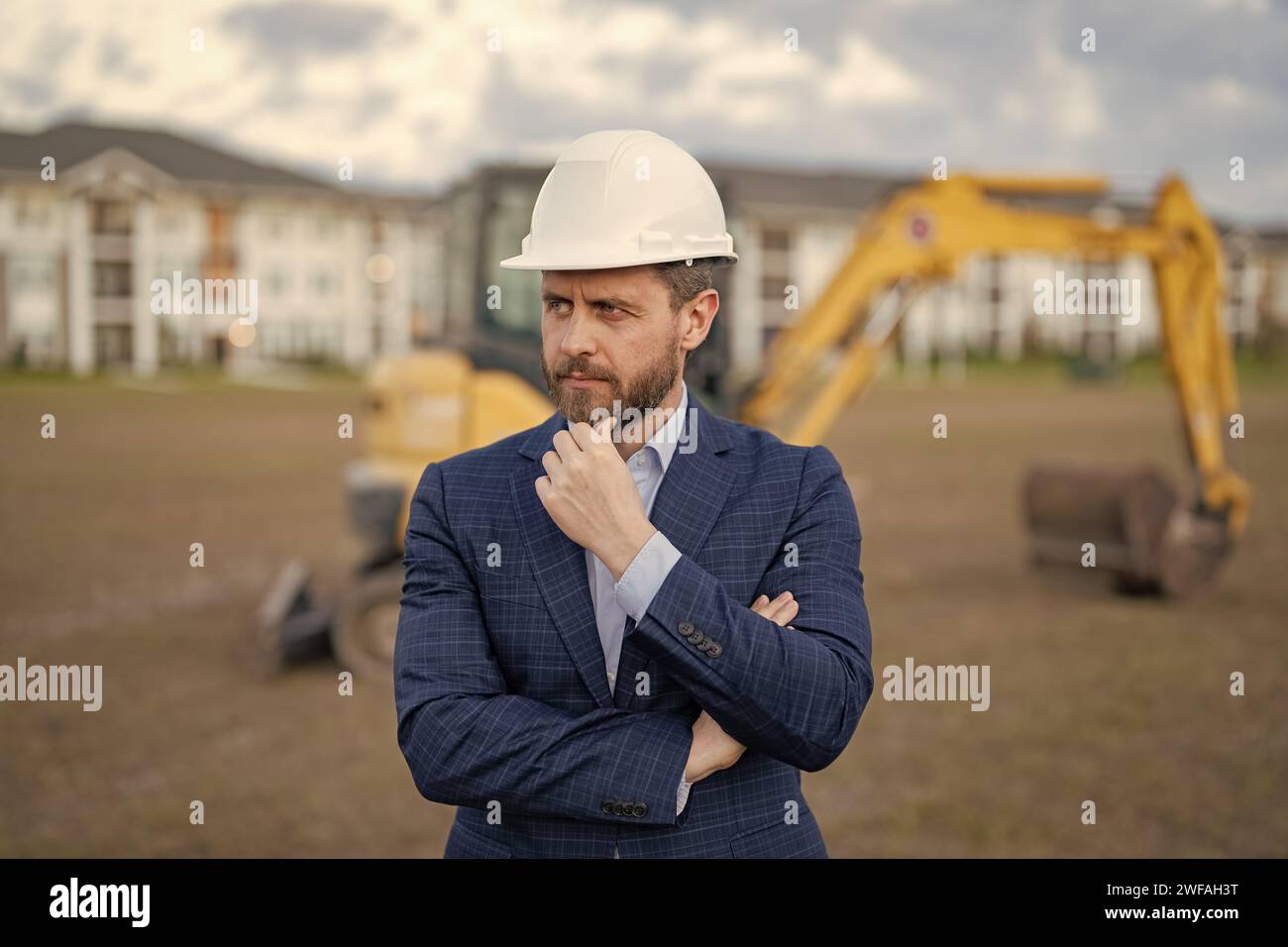 image of civil engineering supervisor wearing hardhat. civil ...