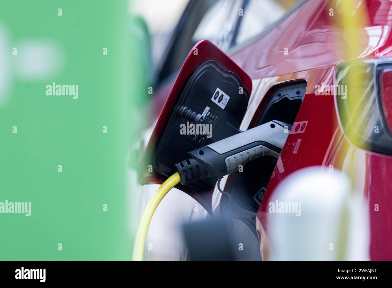 Electromobility, electric car, e-car, being charged at a charging ...