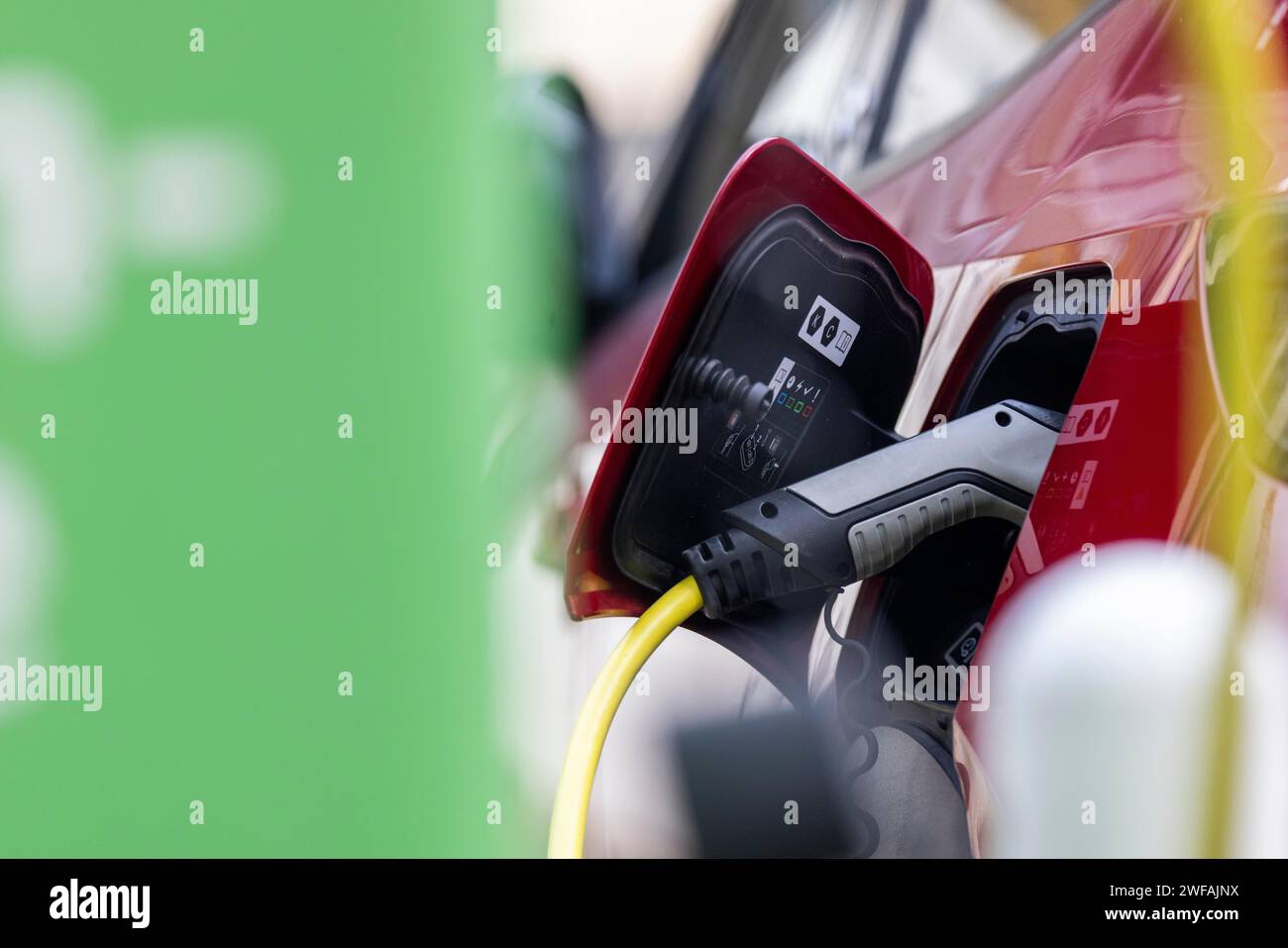 Electromobility, electric car, e-car, being charged at a charging ...