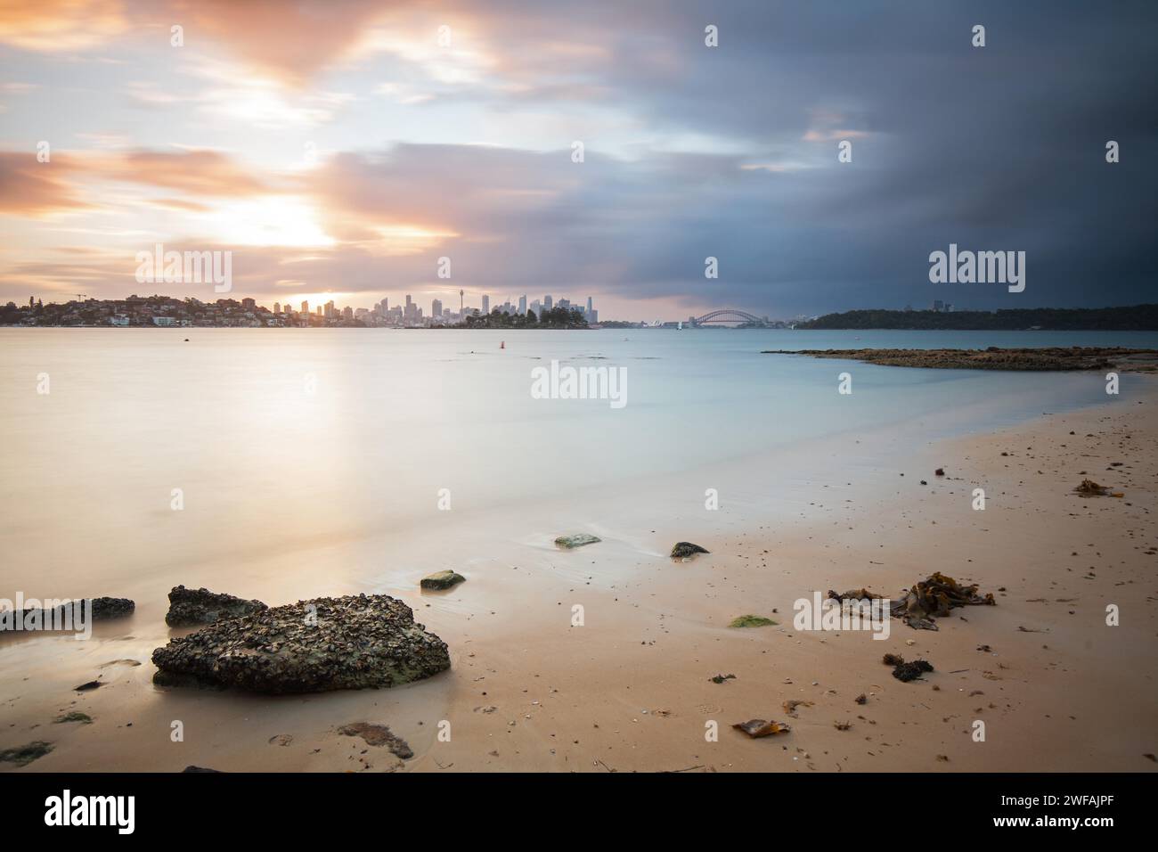 Sunset at Milk Beach in Sydney Stock Photo - Alamy
