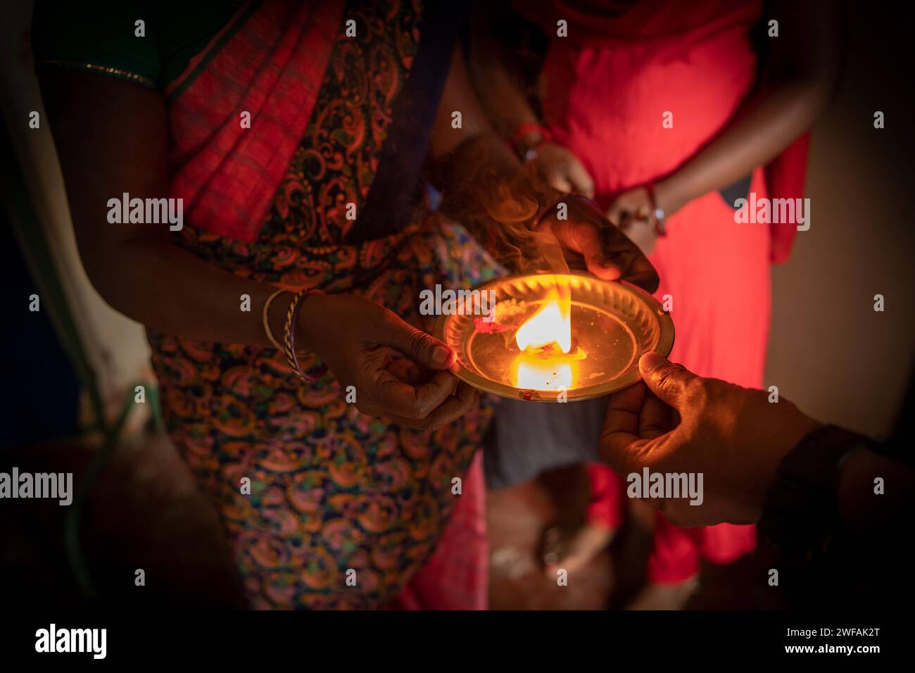 Indian woman holding oil lamp, Aarti light ritual, worship to the ...