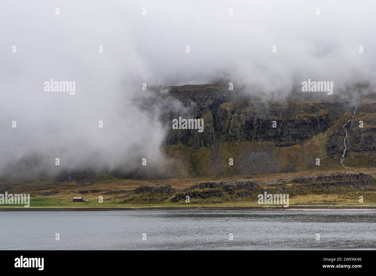 Cloudy mountains, waterfall, Reykjarfjoerour, Strandir, Arnes ...