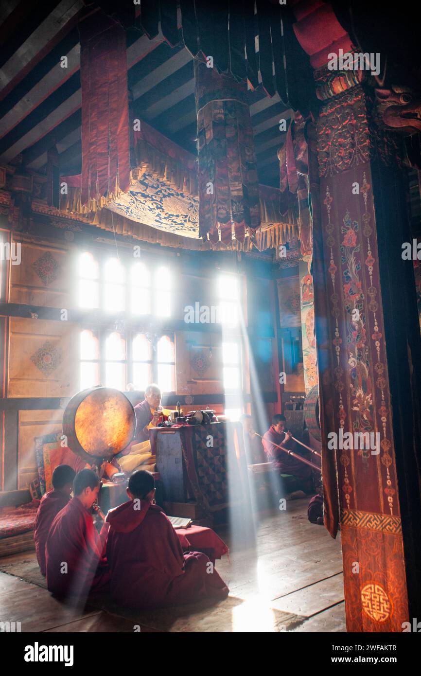 Young monks play musical instruments during a special blessing ceremony ...