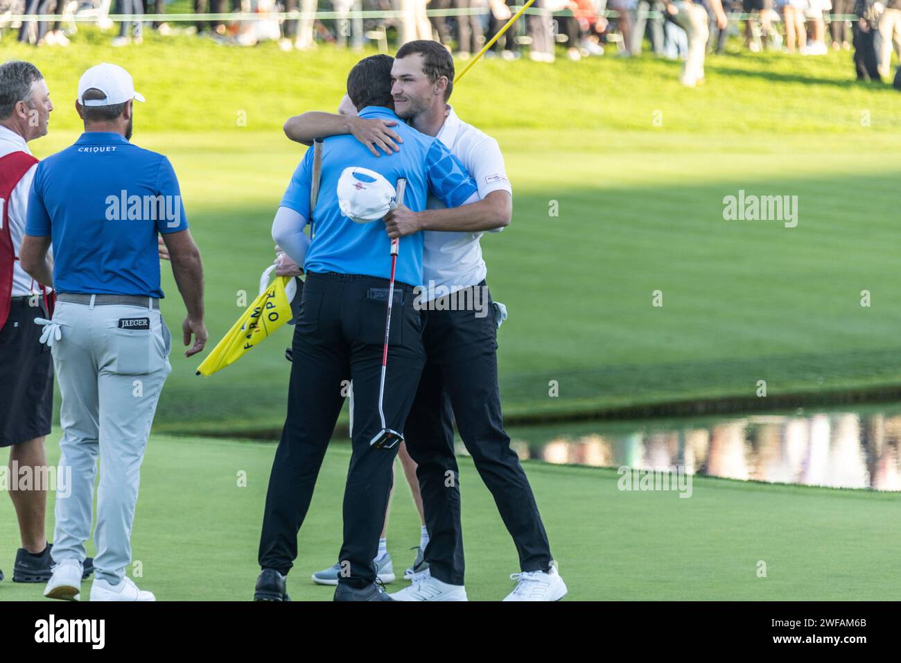 LA JOLLA, CA - JANUARY 27: Matthieu Pavon, left, shares a hug with ...