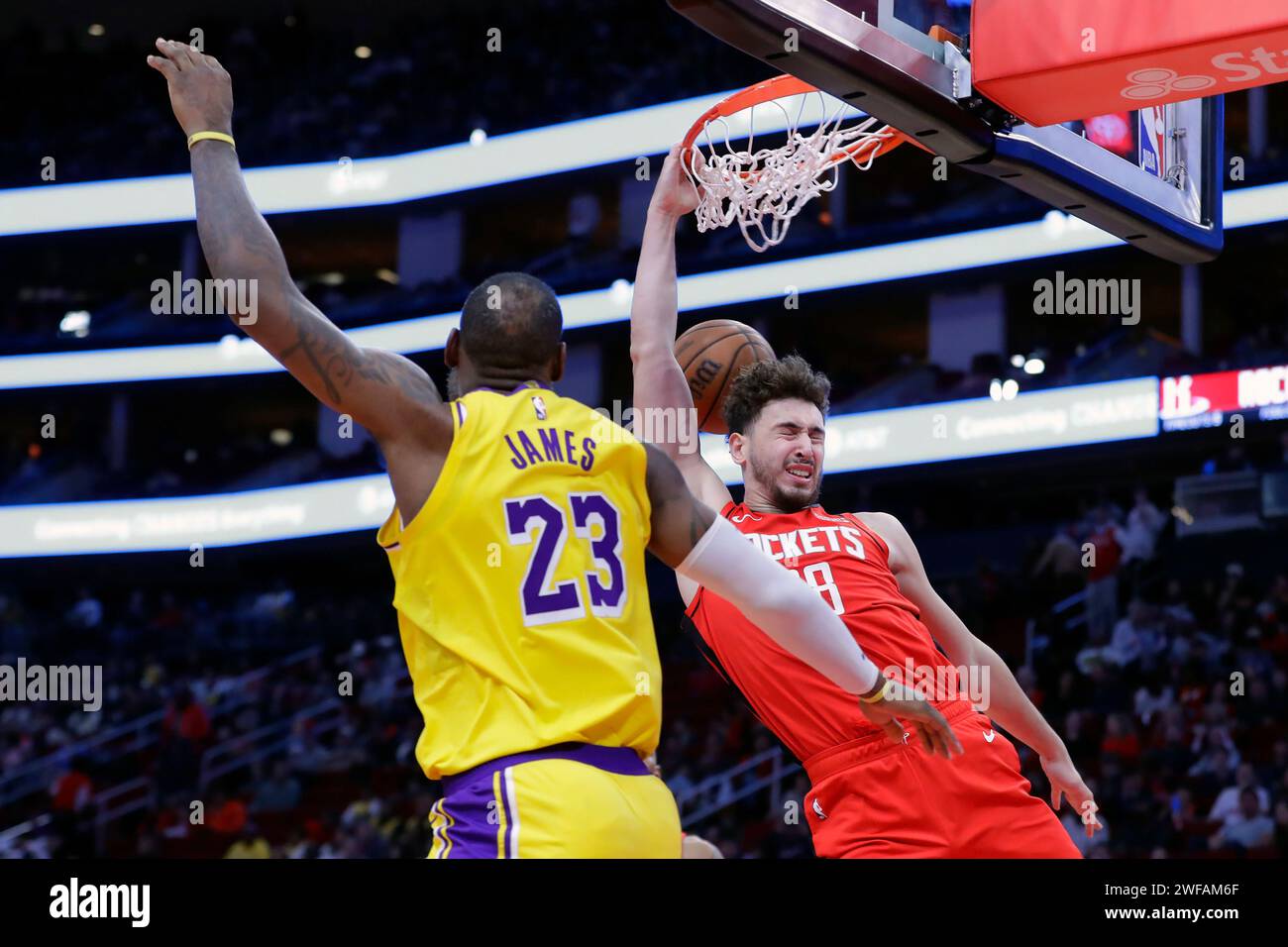 Houston Rockets center Alperen Sengun, right, dunks in front of Los ...