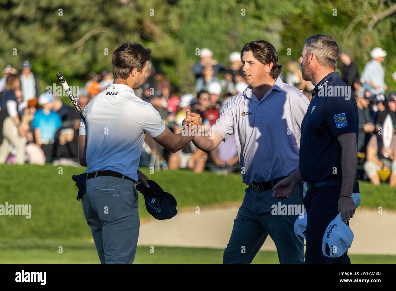 LA JOLLA, CA - JANUARY 27: Thomas Derry, left, shakes hands with Trace ...