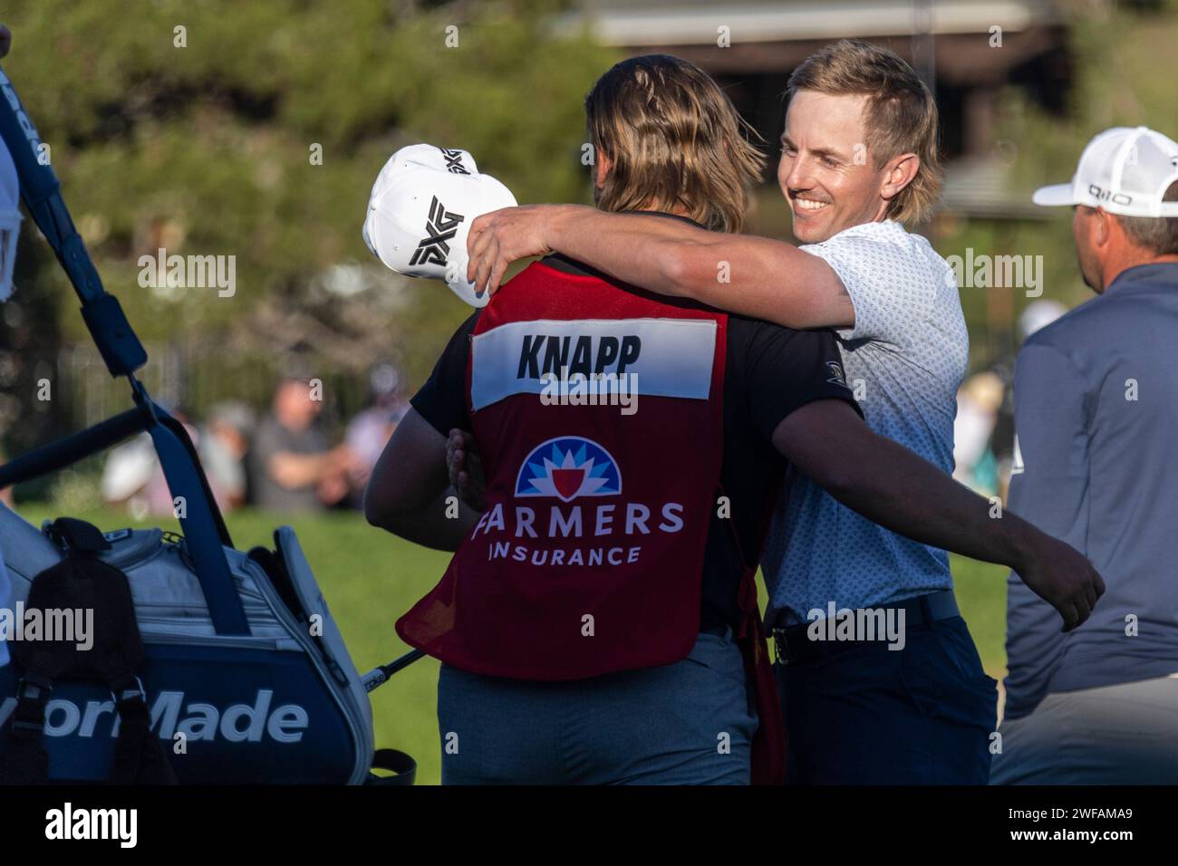 LA JOLLA, CA - JANUARY 27: Jake Knapp, right, hugs his caddie after ...